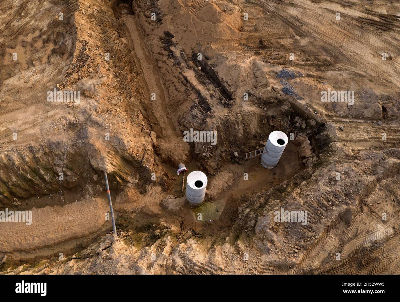 Laying of underground storm sewer pipes and sewerage wells ...