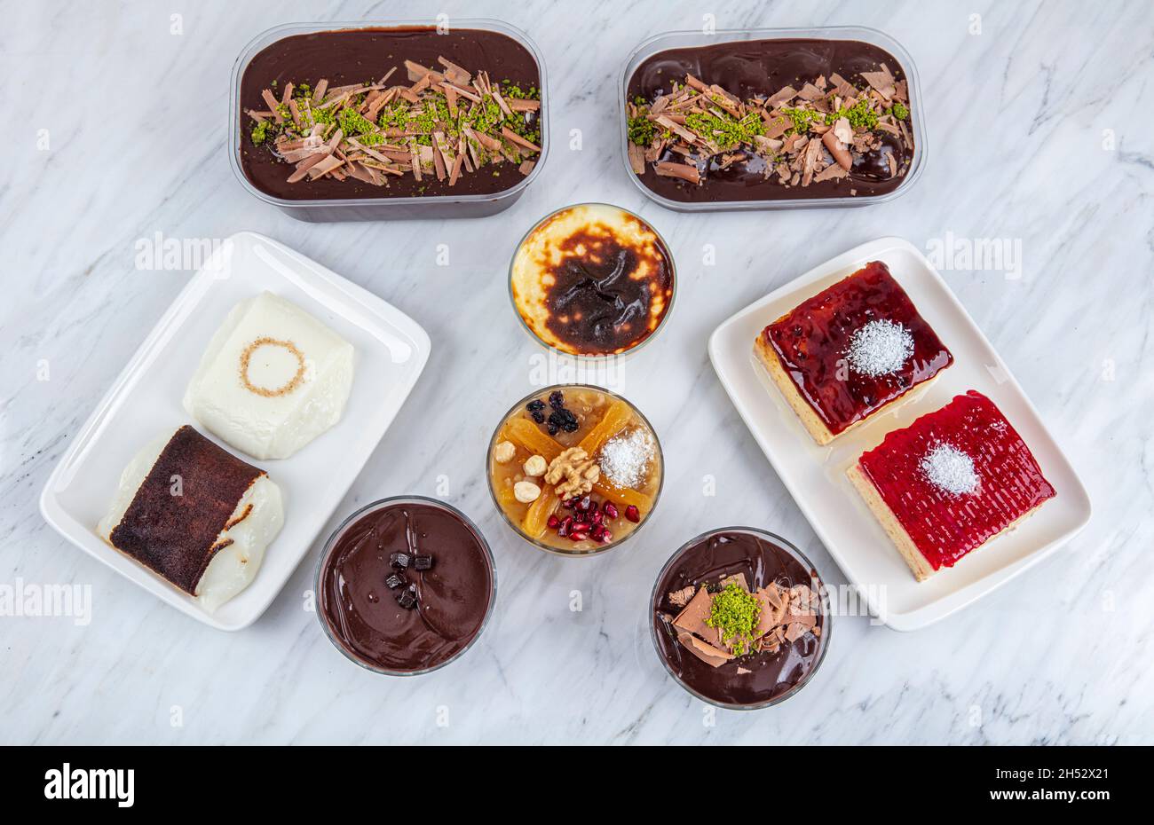 Milky desserts. Various milky fruit desserts decorated with mint and ...