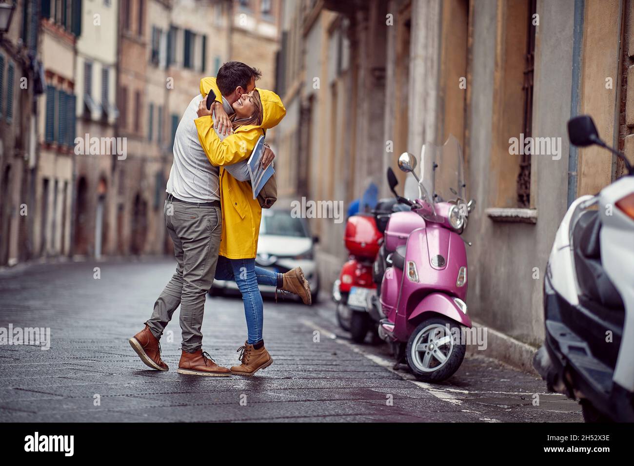 Happy couple in love hugging in the rain.Rainy day outdoors Stock Photo ...