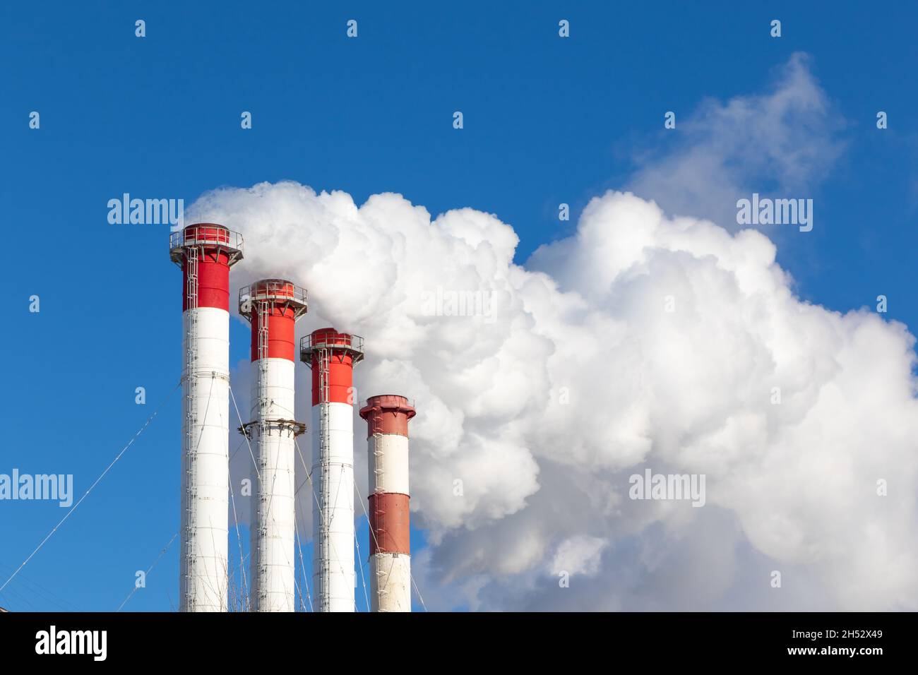 red-white chimneys of the boiler room, equipped with a traffic light ...