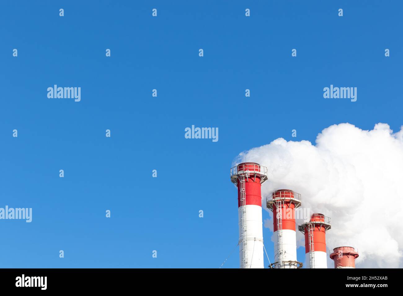 red-white chimneys of the boiler room, equipped with a traffic light ...