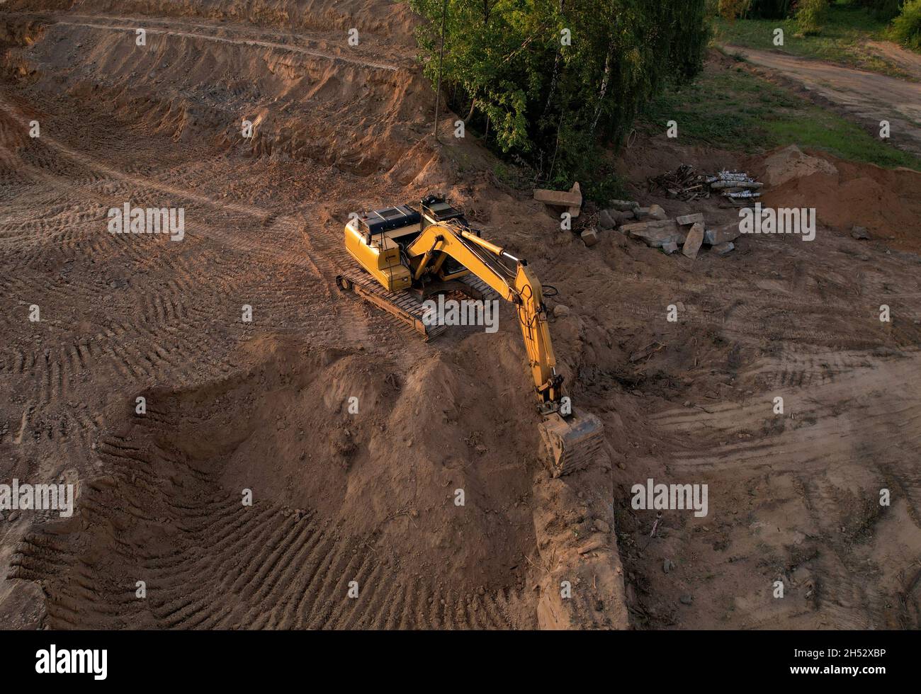 Excavator dig ground at construction site. Foundation pit for a multi ...