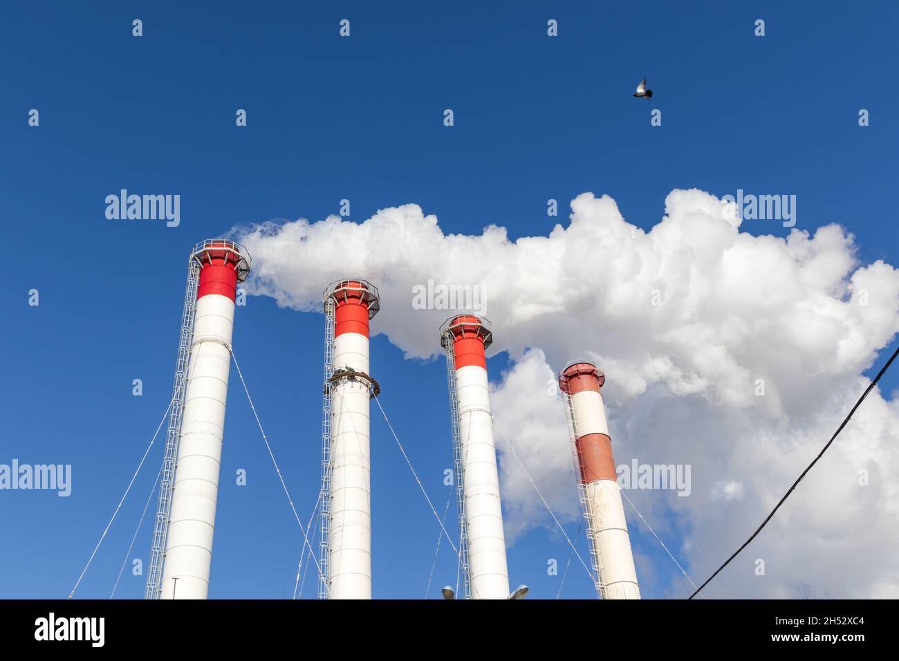 red-white chimneys of the boiler room, equipped with a traffic light ...