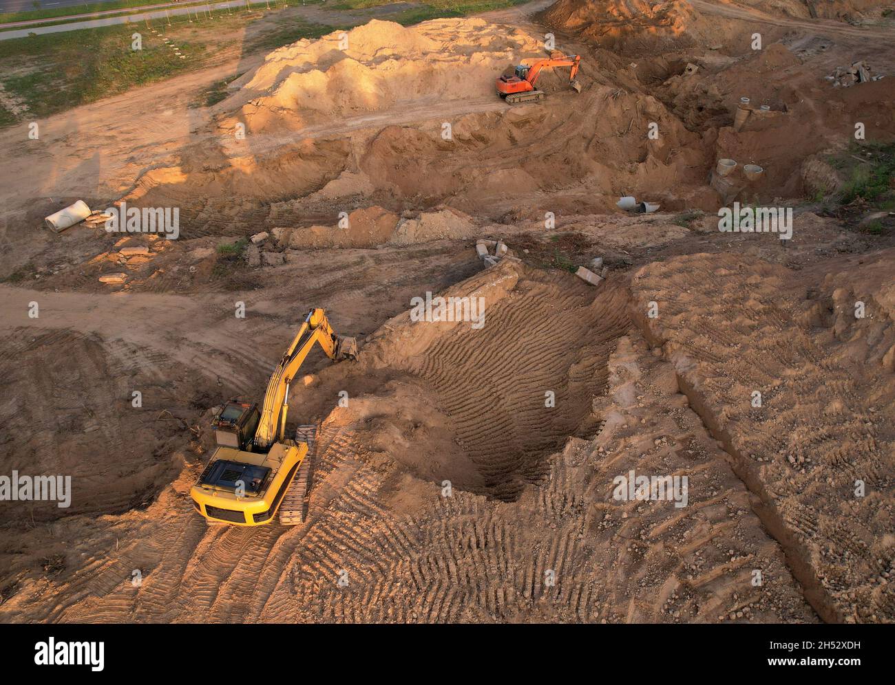 Excavator dig ground at construction site. Foundation pit for a multi ...
