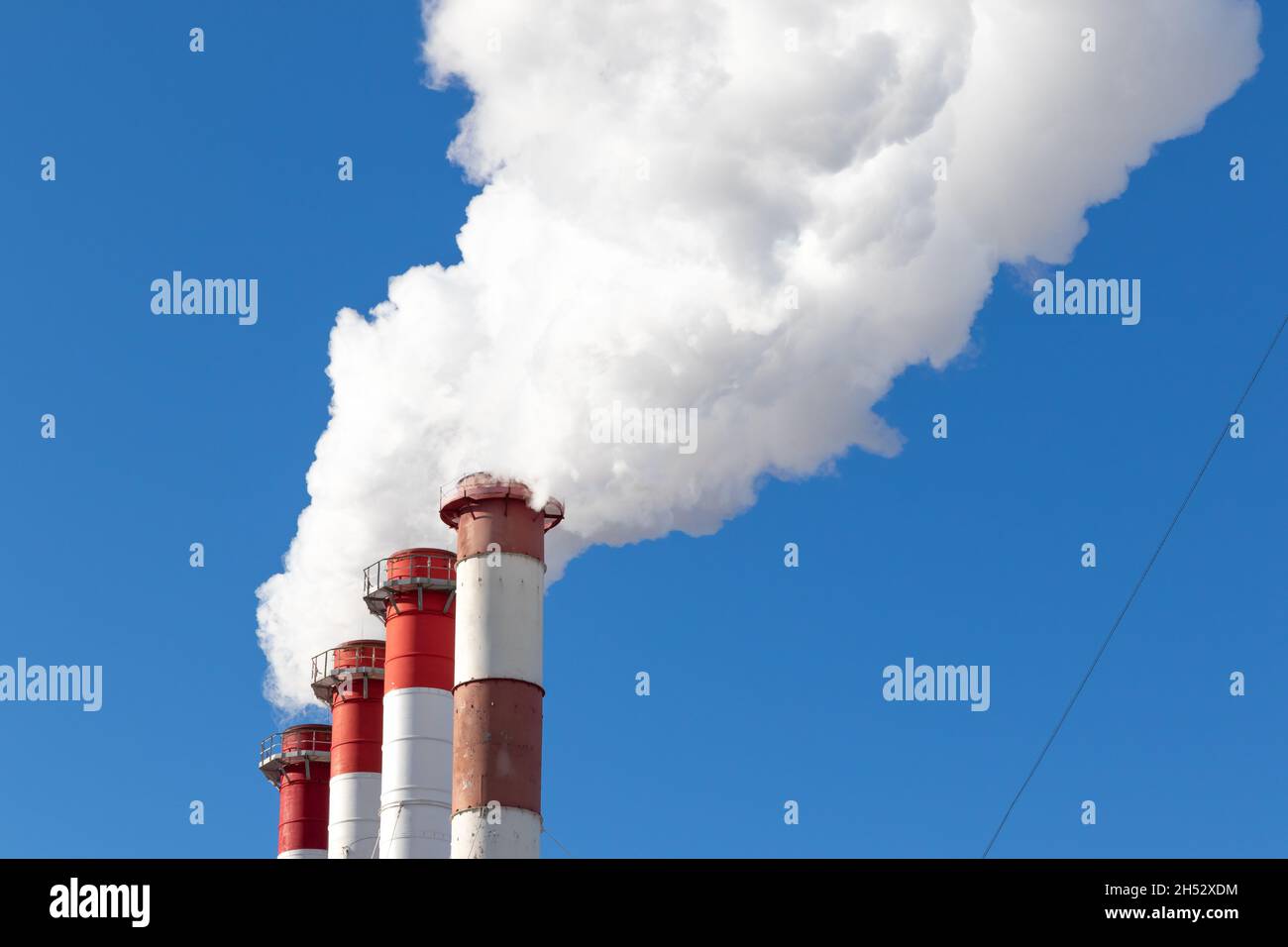 red-white chimneys of the boiler room, equipped with a traffic light ...