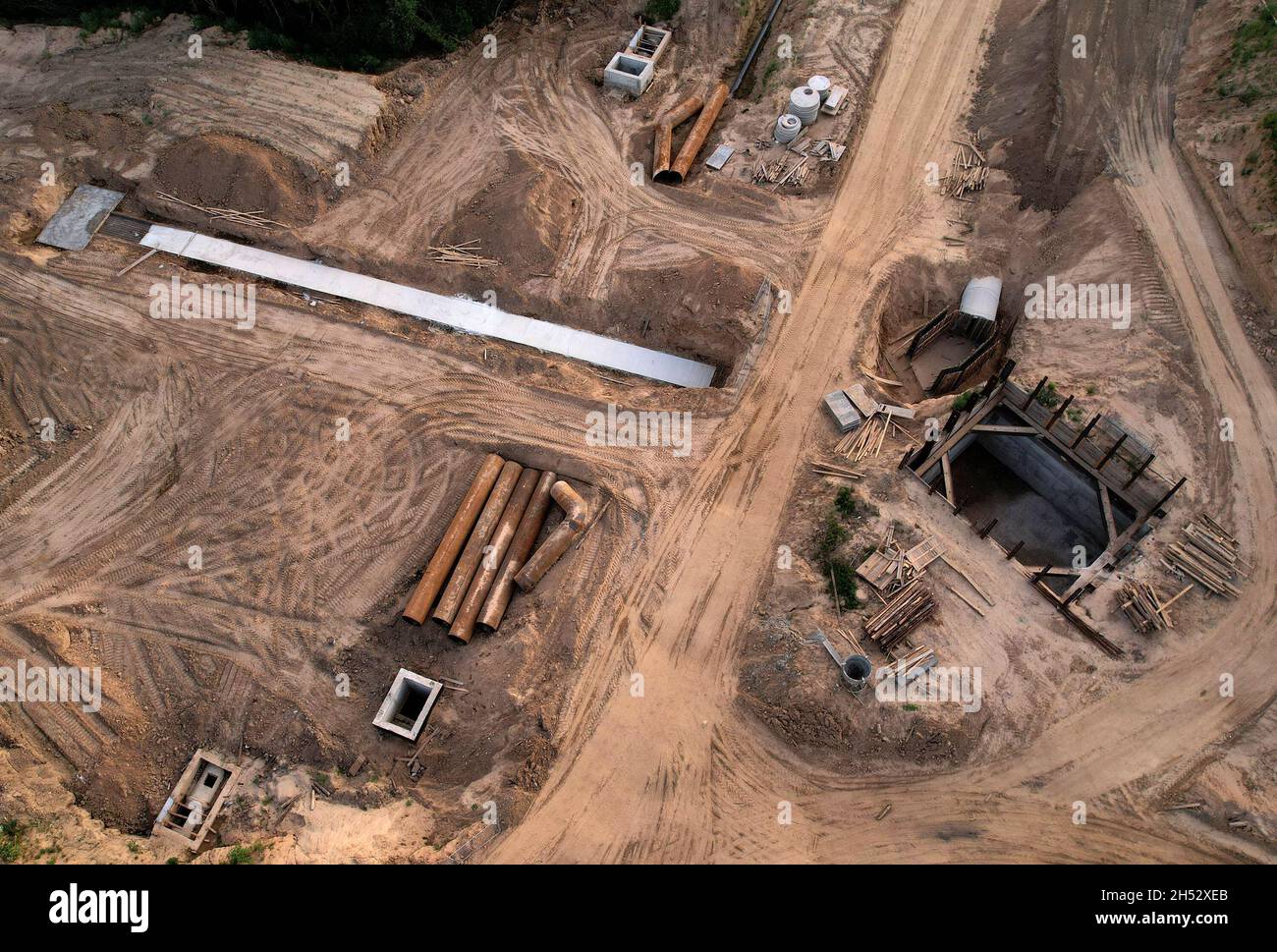 Construction of stormwater pits and sanitary sewer system. Laying of ...