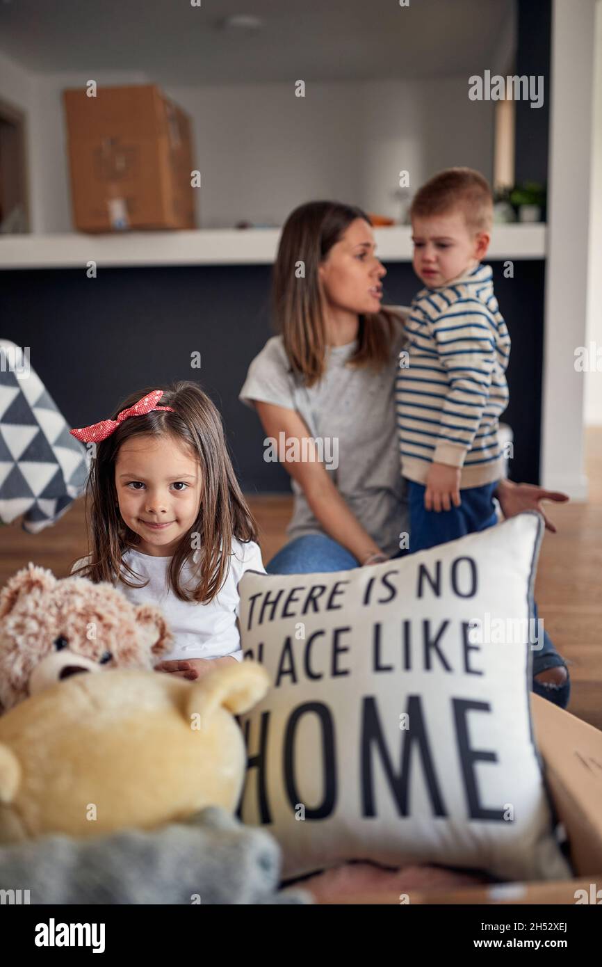 Caucasian family with two children moving in new place Stock Photo - Alamy
