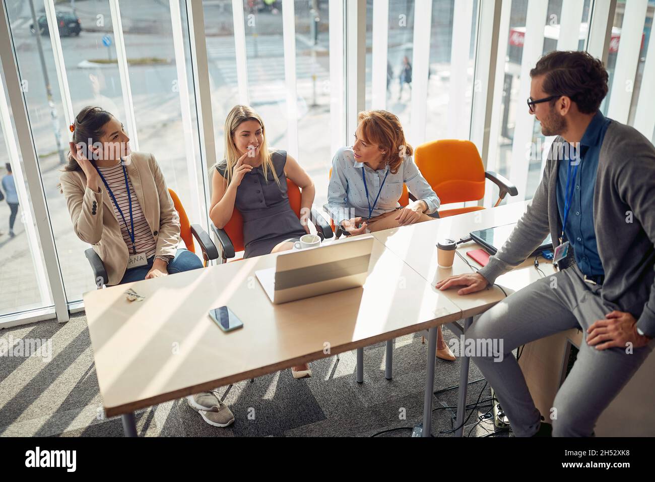 Multiethnic colleagues smiling talking meeting hi-res stock photography ...