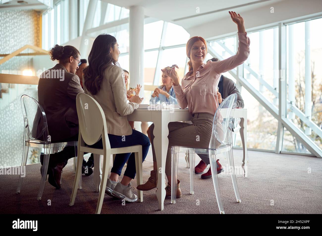 Young woman on a lunch break calls a colleague Stock Photo - Alamy