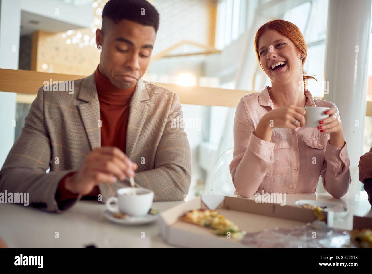 Female coworkers laughing hi-res stock photography and images - Alamy
