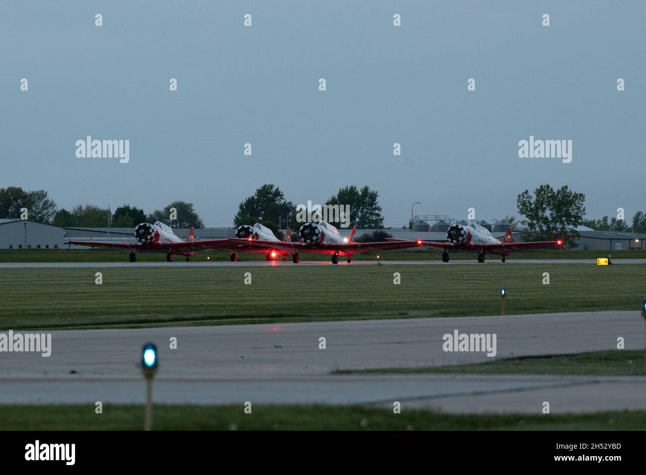 Row of military aircraft ready for take-off in an airport Stock Photo ...