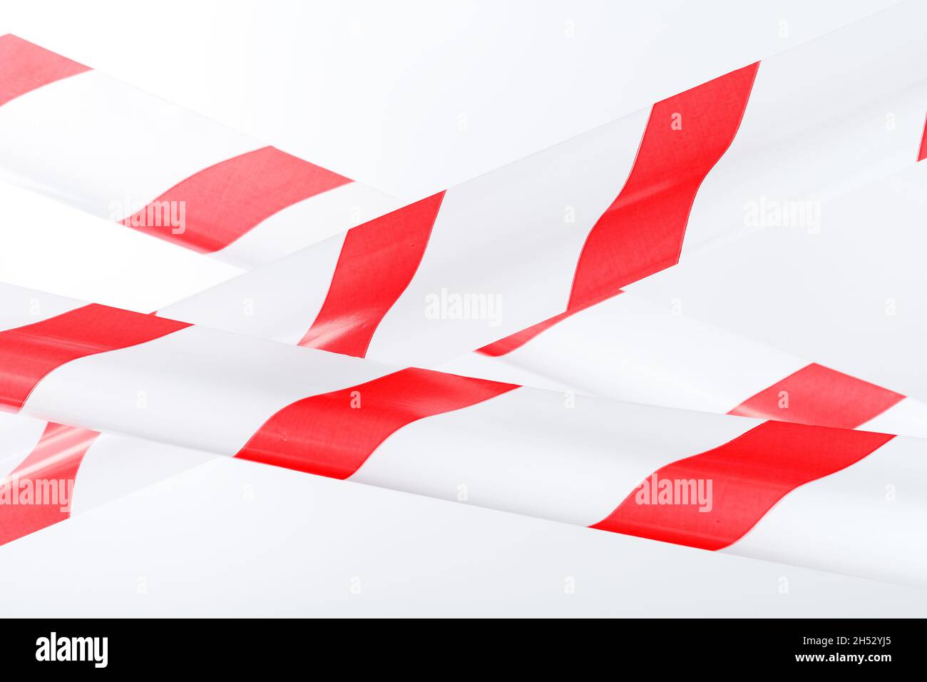 The tape is red and white for fencing danger on a white background ...