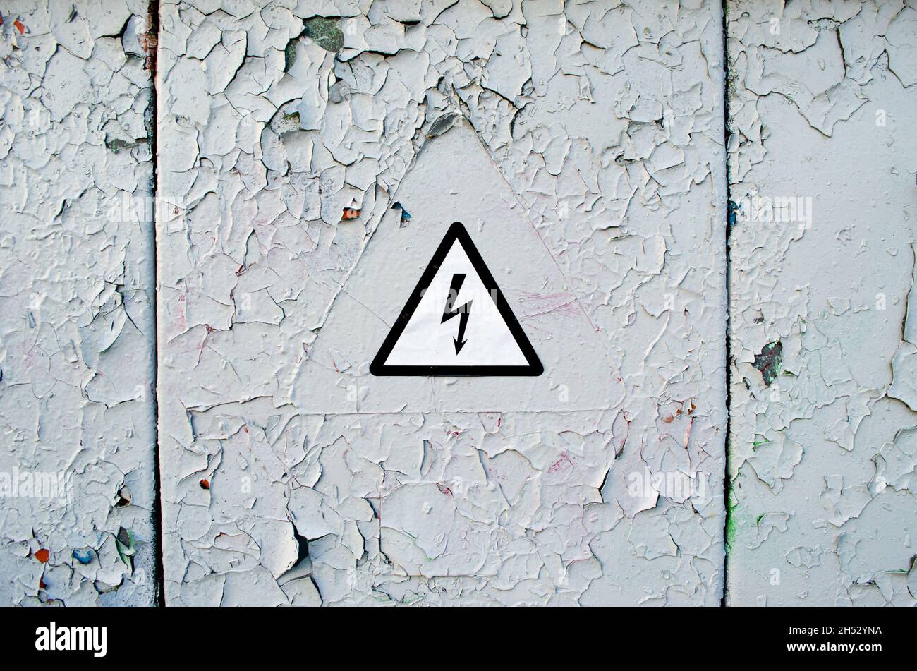 Caution. High voltage. Warning of the danger sign on a metal wall Stock ...