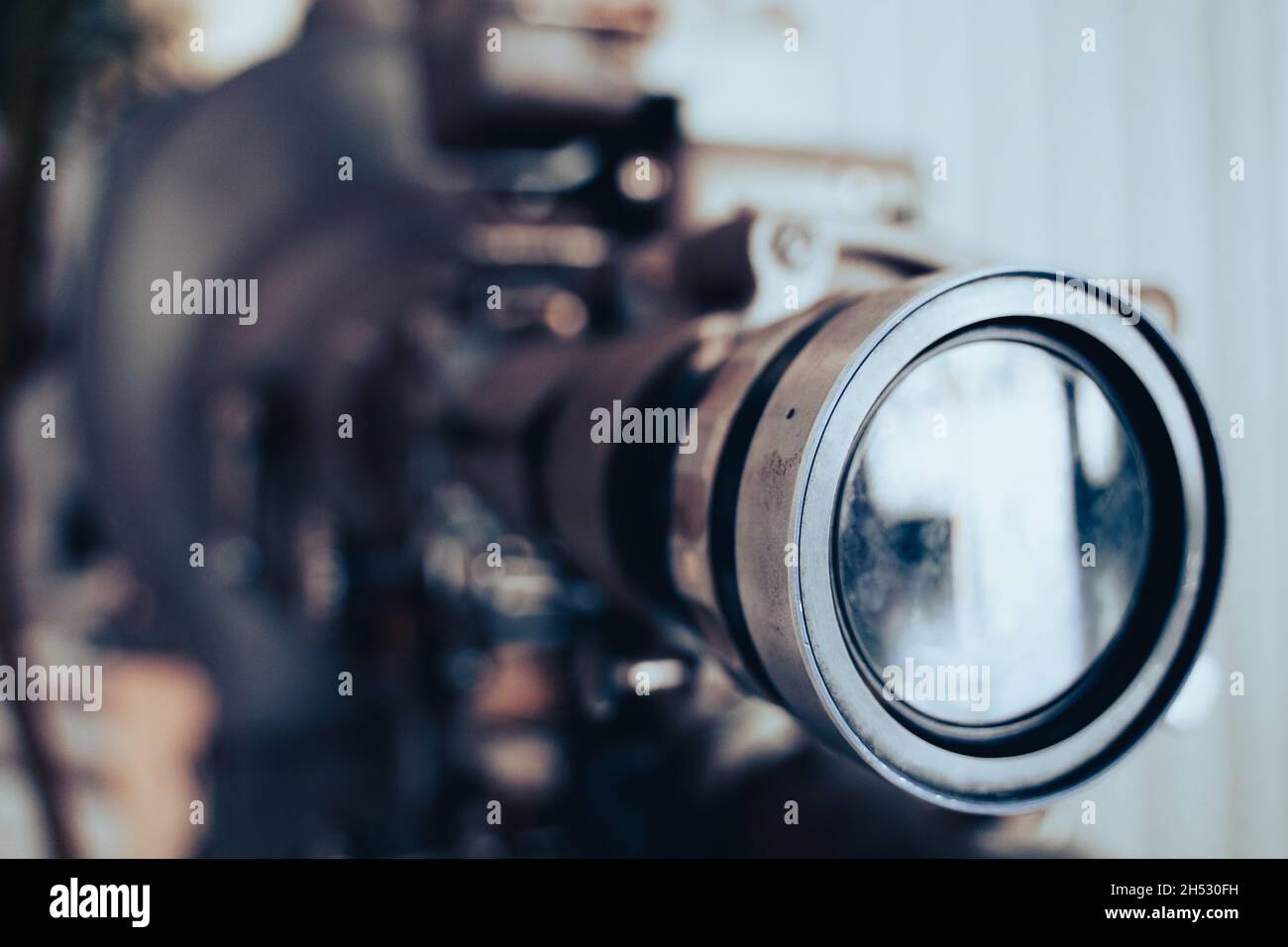 front view closeup of metallic vintage cinema theatre projector wide ...