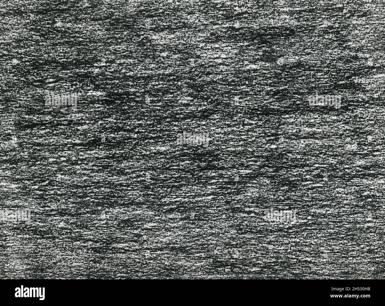 closeup of heavy black pencil horizontal doodles brushes on white ...