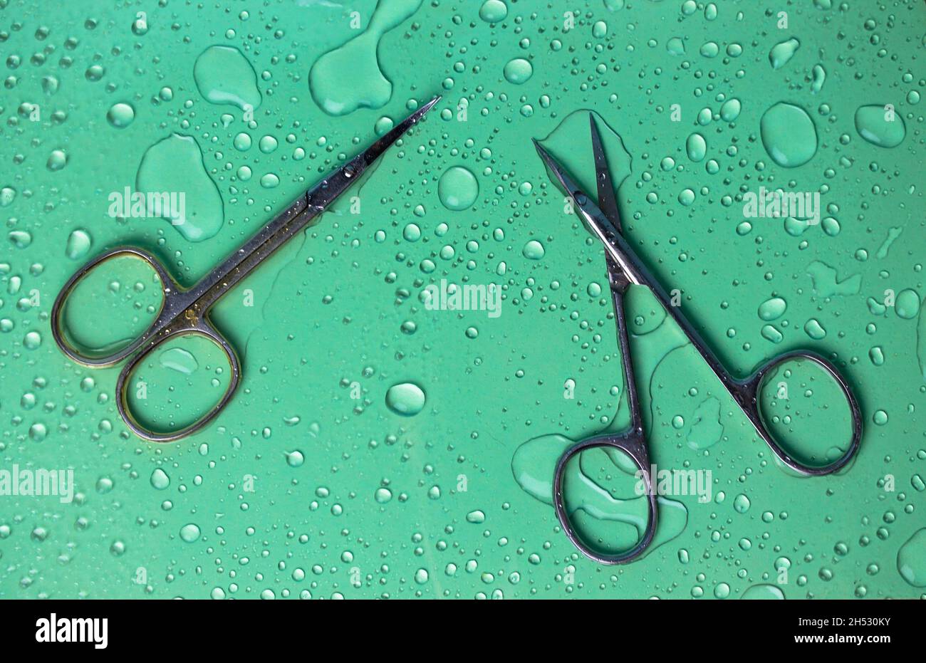 Sharp titanium manicure scissors for trimming cuticles on green ...