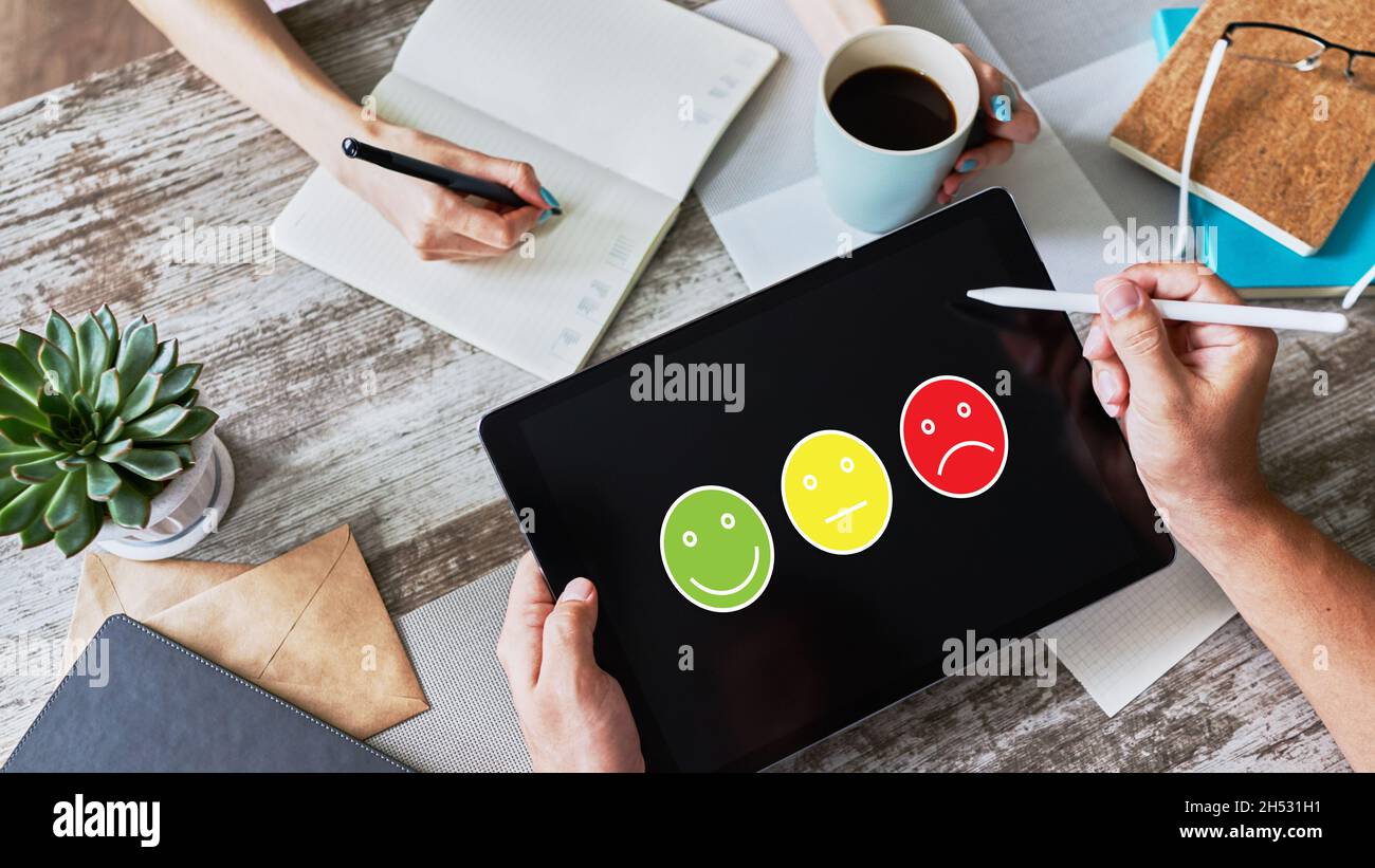 Colored smiles. Customer satisfaction control on device screen. Service ...