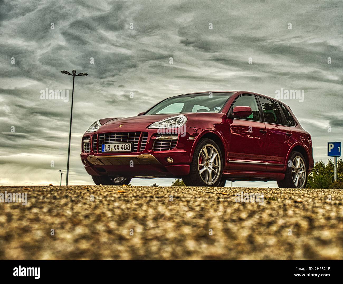 Porsche Cayenne GTS 9PA in red with silver rims Stock Photo - Alamy