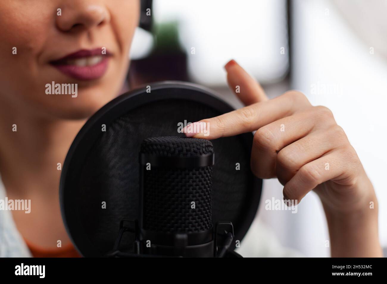 Closeup of content creator testing microphone sound. Woman influencer ...