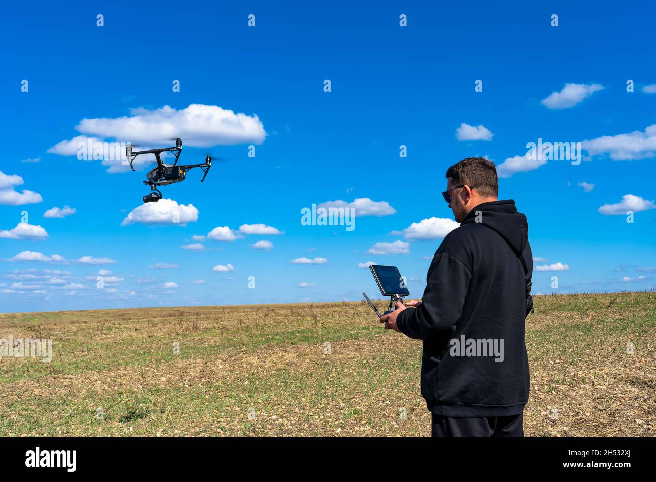 The pilot controls a professional drone Stock Photo - Alamy