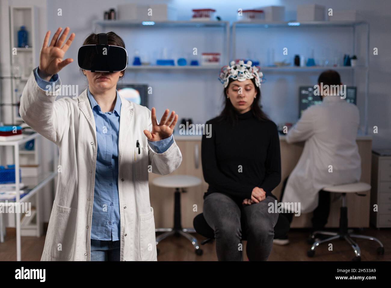 Neurologist specialist doctor with virtual reality headset analyzing ...