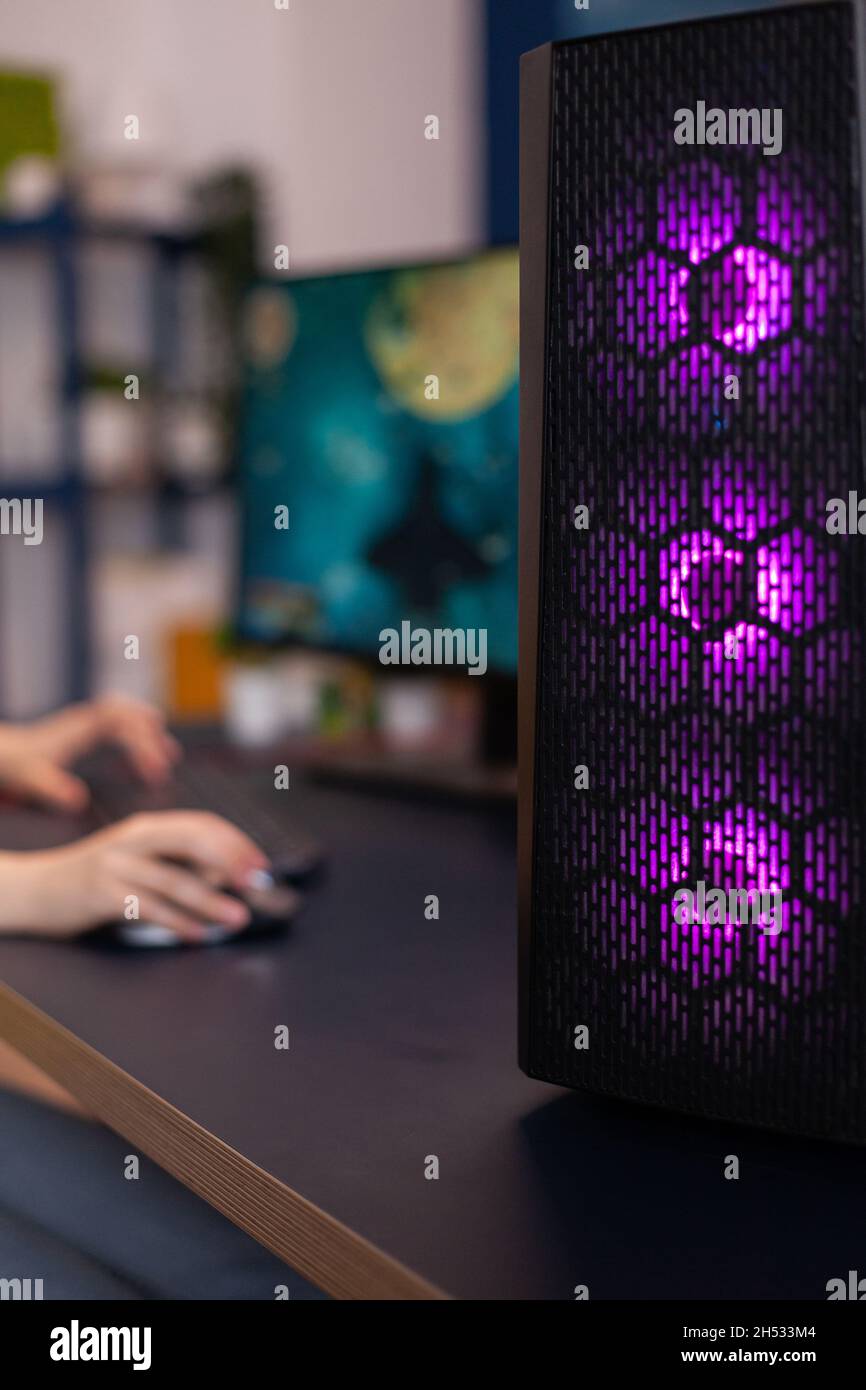 Closeup of RGB led lights system desktop, woman gamer playing space ...