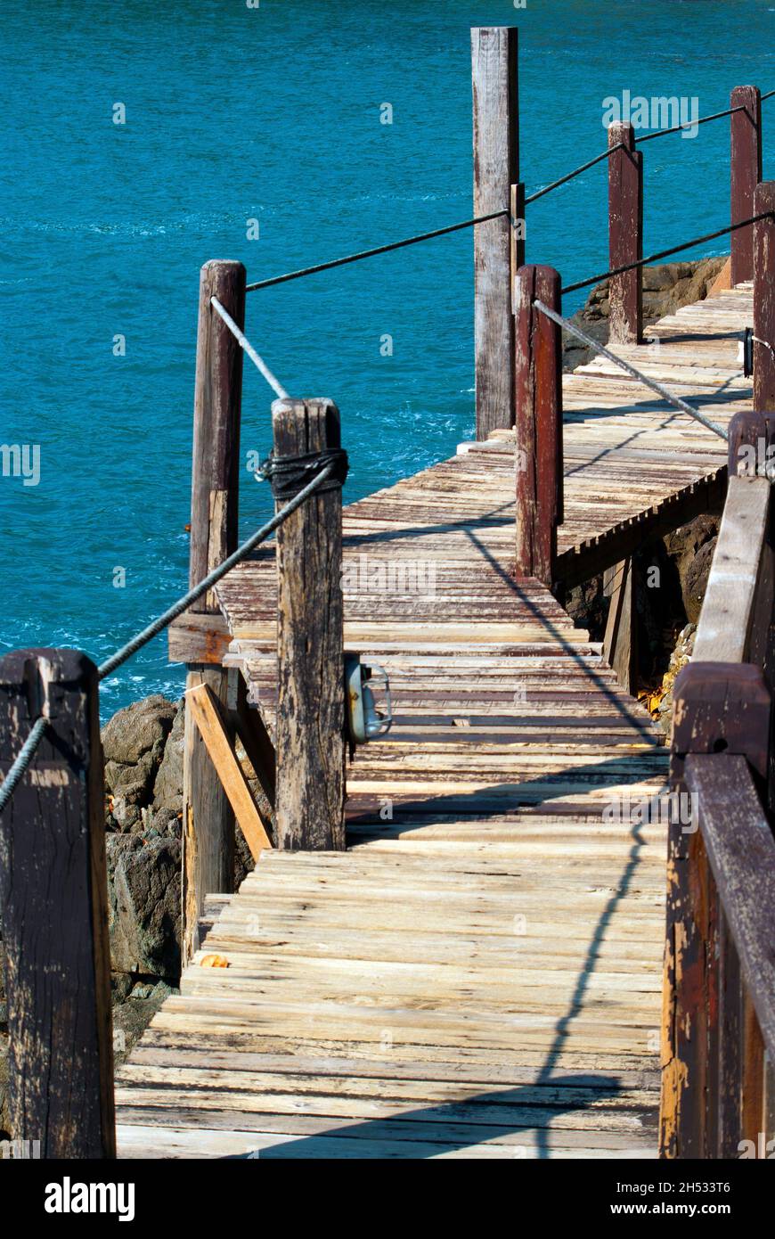 The wooden bridge at cliff and sea Stock Photo - Alamy