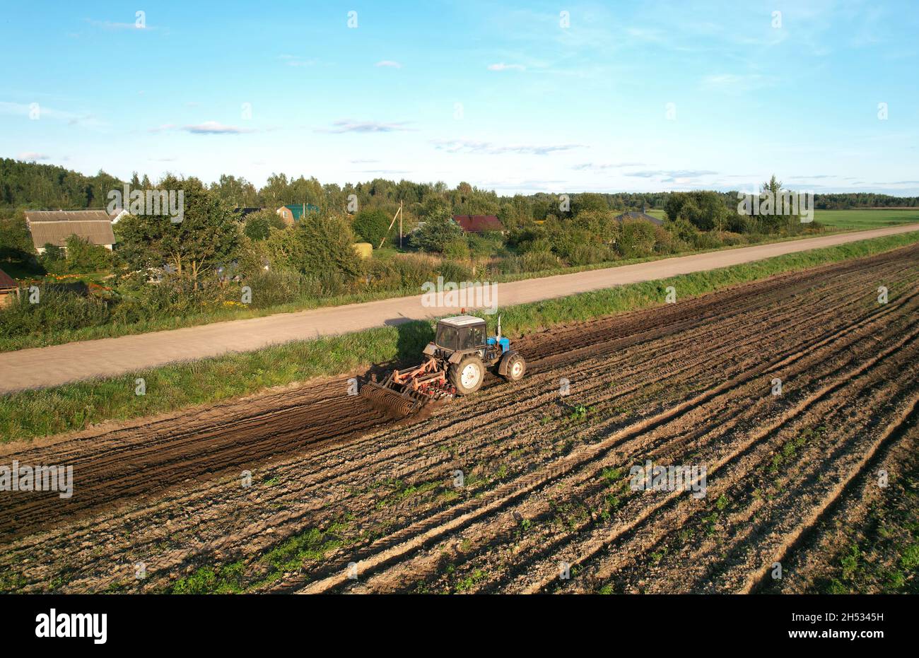 Tractor with Plough on Plowed. Ploughing and Soil Tillage. Agricultural ...