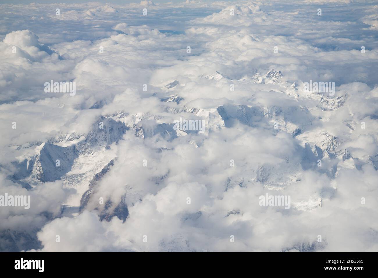 View of the Alps from the airplane window Stock Photo - Alamy