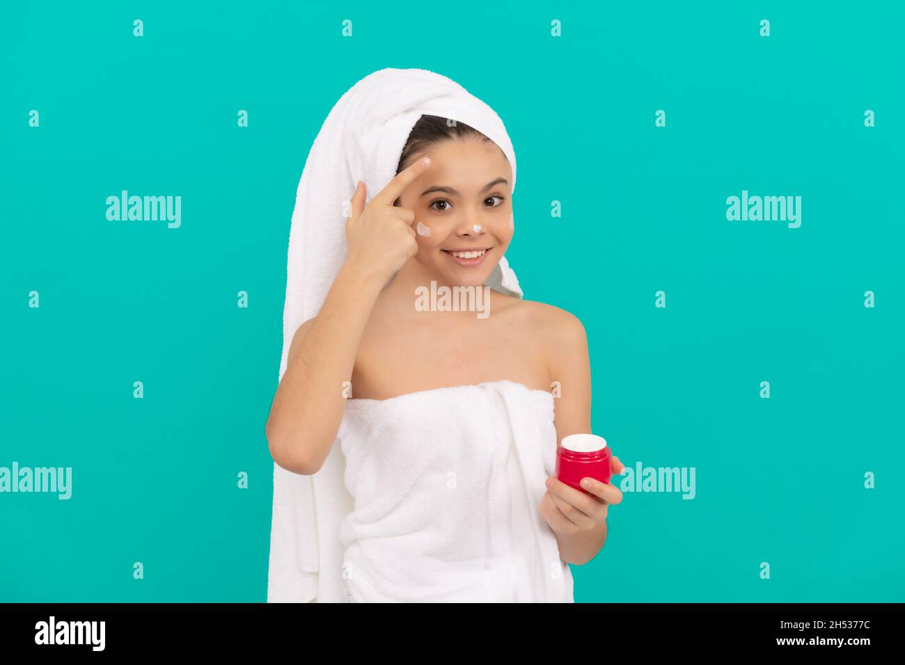 kid use face cream. tween girl hold hair mask. child with skin cream ...