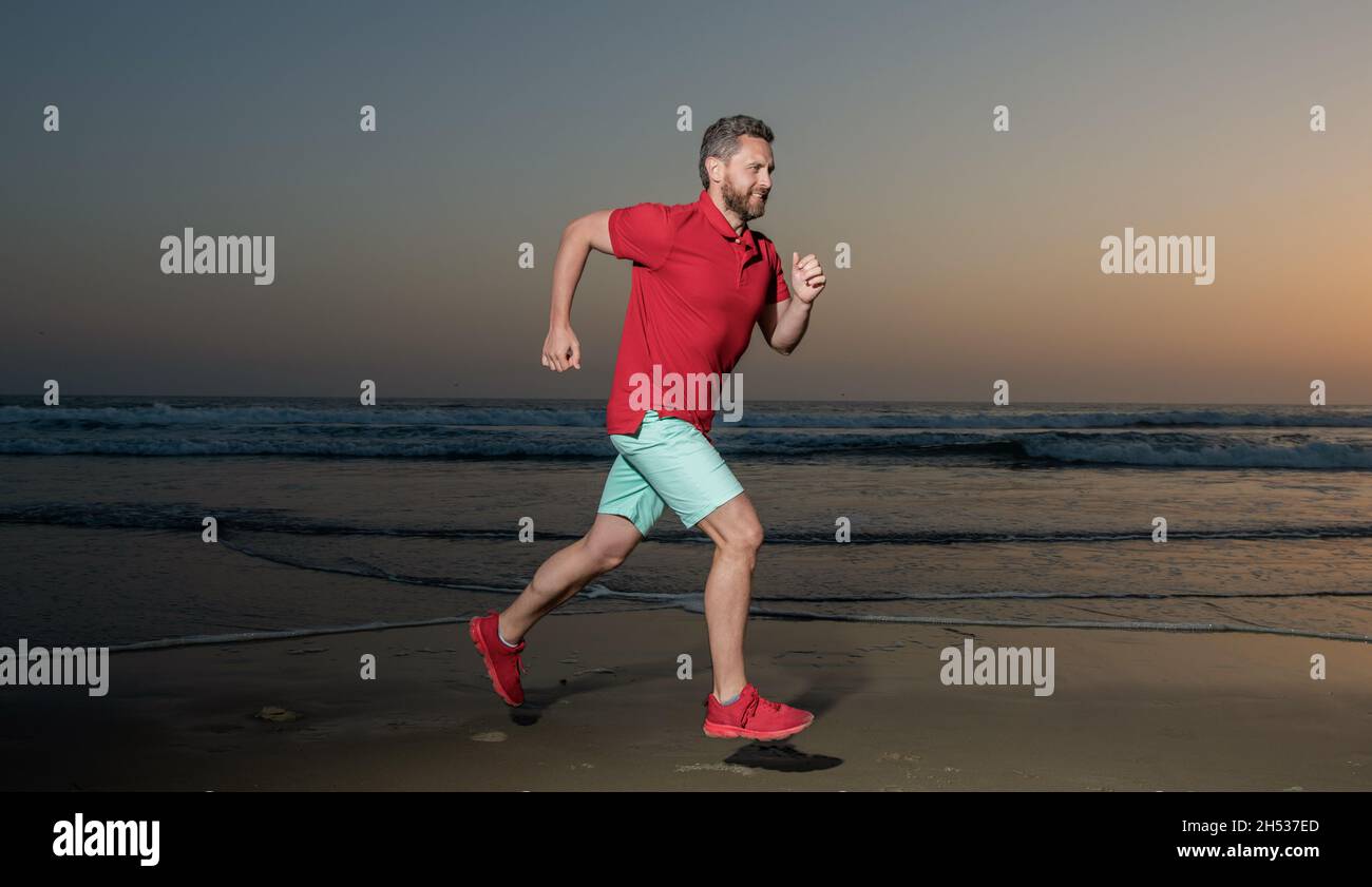sportsman sprinter running on sunrise summer beach at ocean, athlete ...