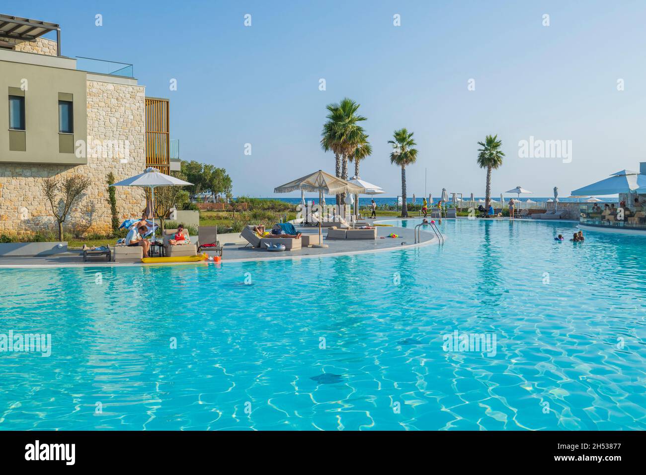 View of exterior of Portes Lithos Luxury Resort hotel building with ...