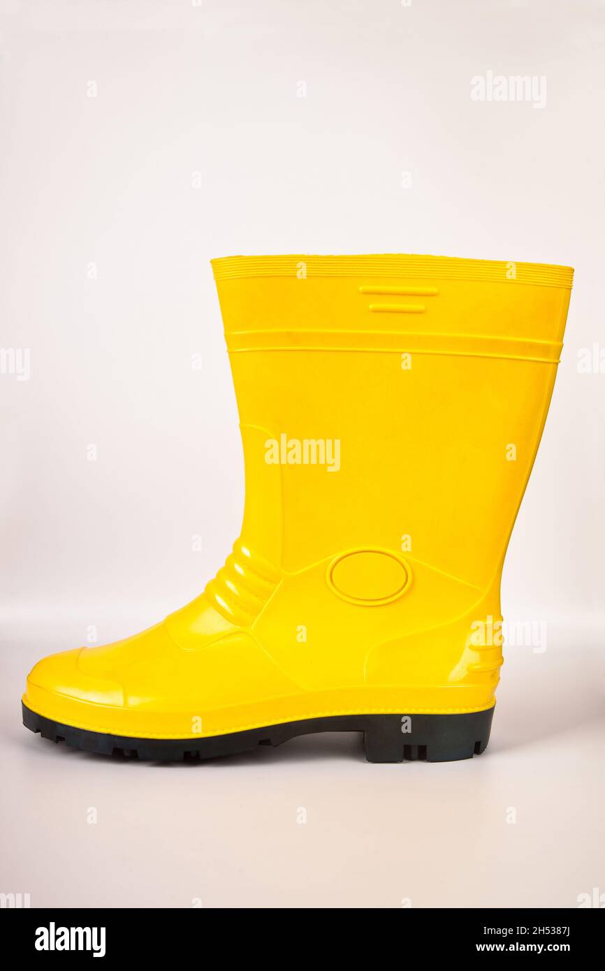Robust and waterproof yellow rubber boots isolated on white background ...