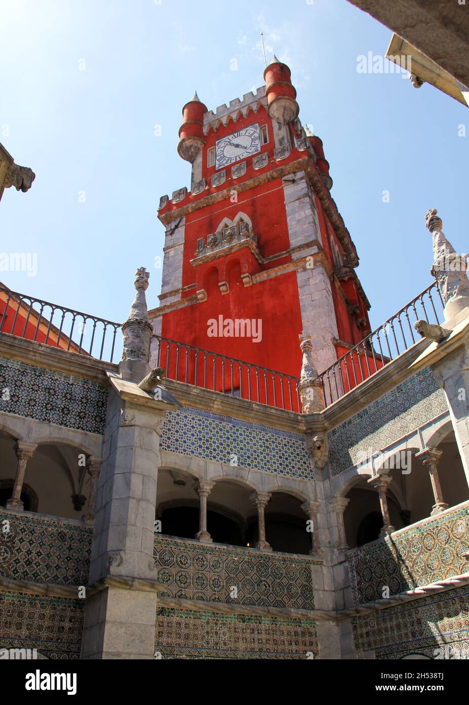 Red clock tower of the Pena Palace, view from the inner court of the ...