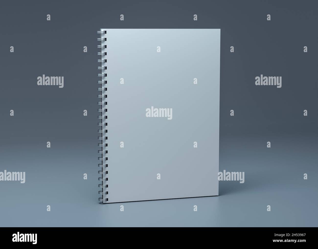 Blank spiral notebook on a light blue background. Template for your ...