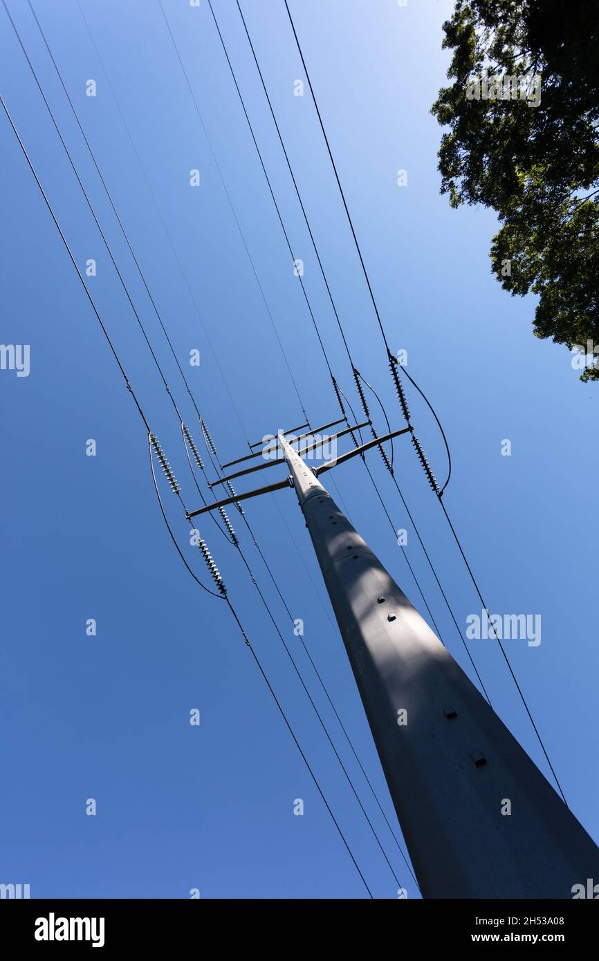 Vertical low angle shot of a transmission tower under the daylight sky ...