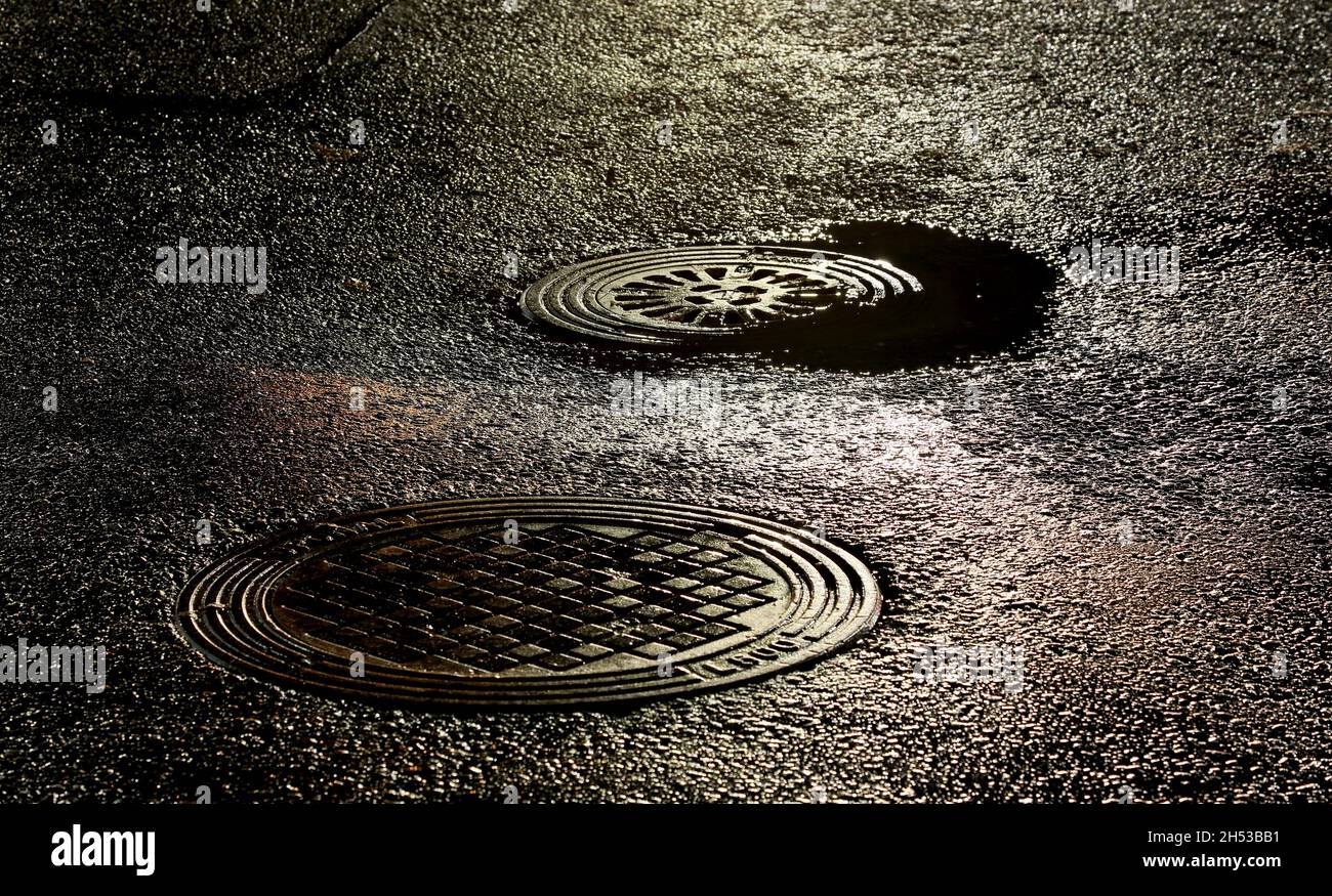 Street inlet after rain shower late in the night Stock Photo - Alamy