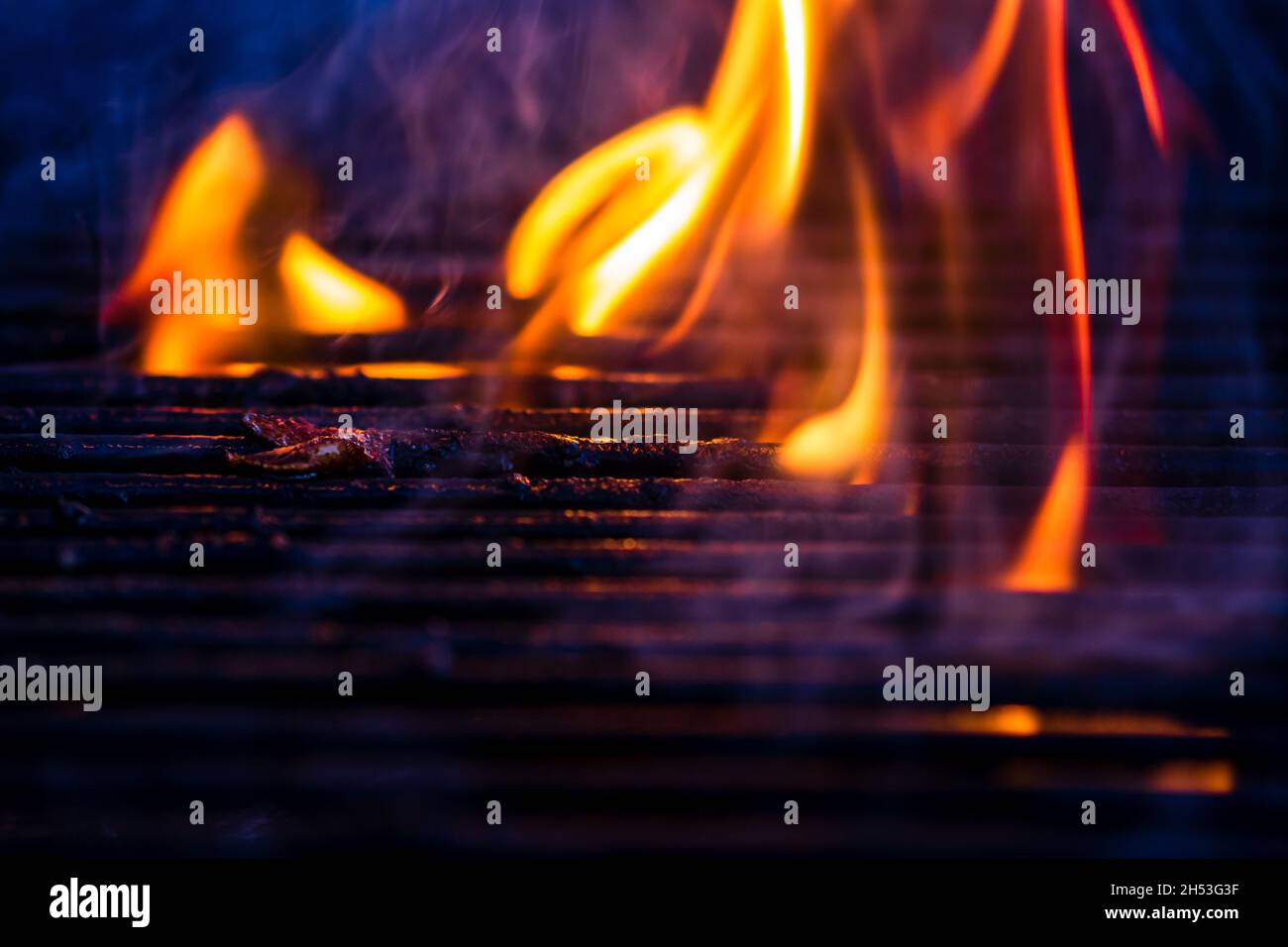 Barbecue grill pit with glowing and flaming hot open fire with red ...