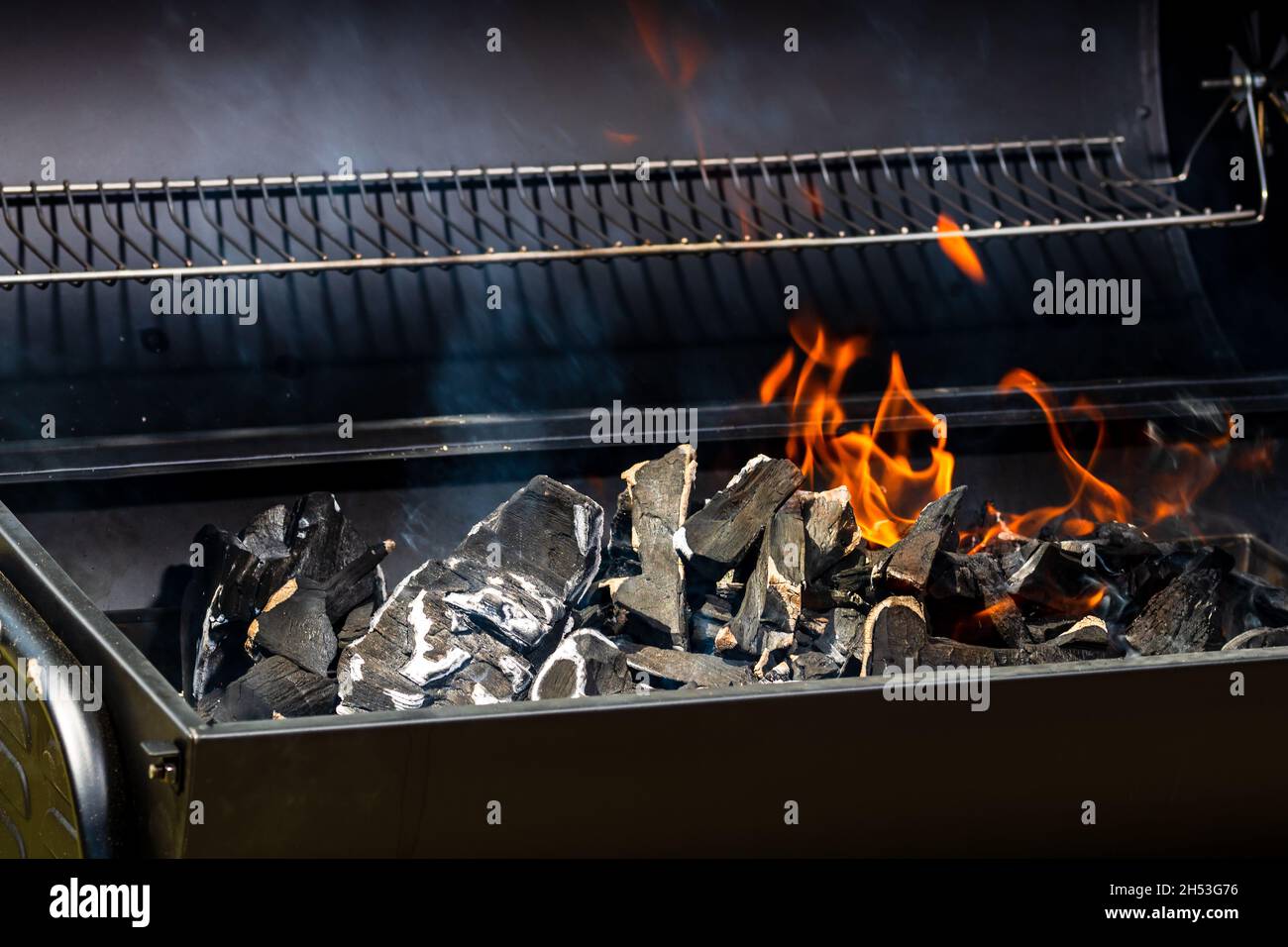 Barbecue grill pit with glowing and flaming hot open fire with red ...