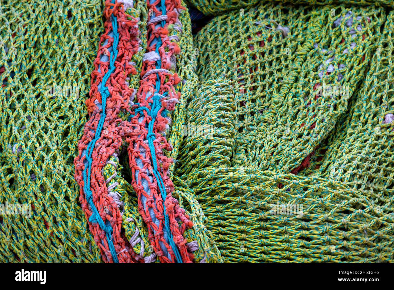 Fishing net on a fishing vessel deck. Close-up shot Stock Photo - Alamy