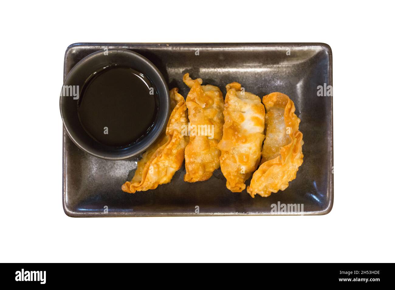 Top view of gyoza and sauce on white background Stock Photo - Alamy