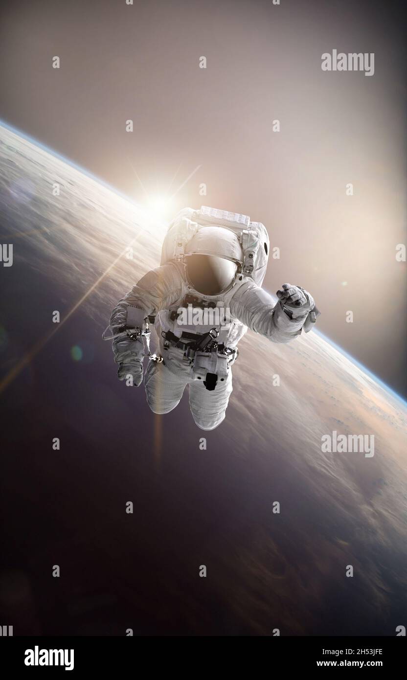 Astronaut in outer,open space over the planet Earth.Stars provide the ...
