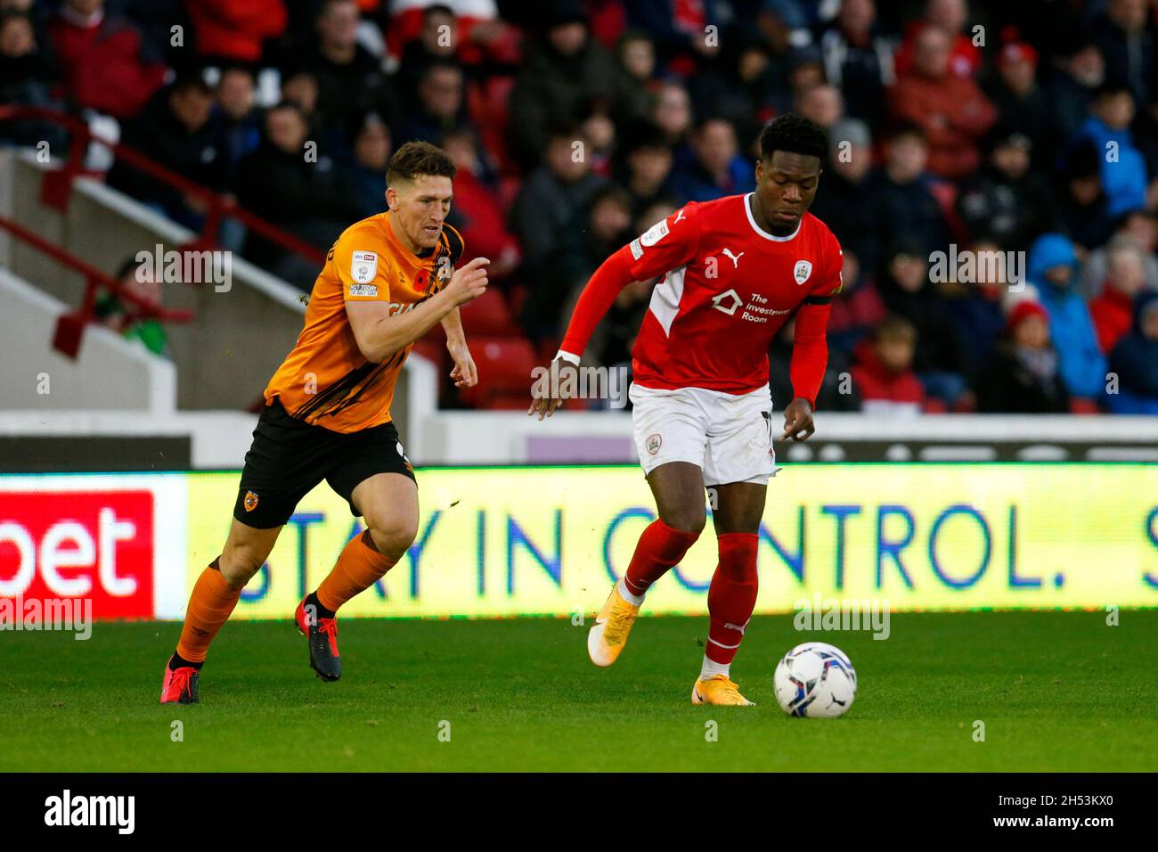 Richard Smallwood #6 of Hull City and Aaron Leya Iseka #11 of Barnsley ...