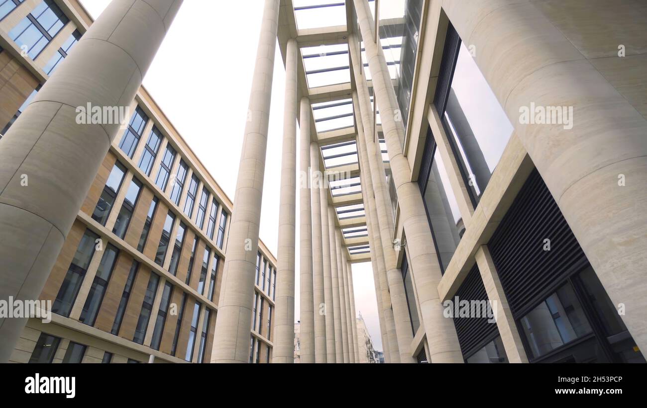 Beautiful colonnade of modern business building. Action. External ...