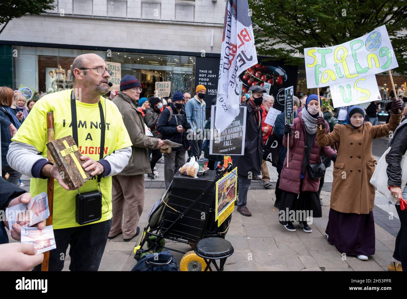 Born again Christian street preacher shouts to protesters that the ...