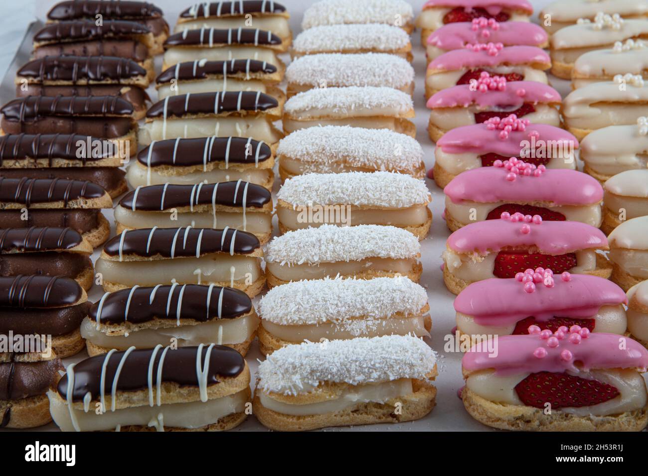 Ekler Pasta Chocolate Donut in plate. A lot of french dessert of ...