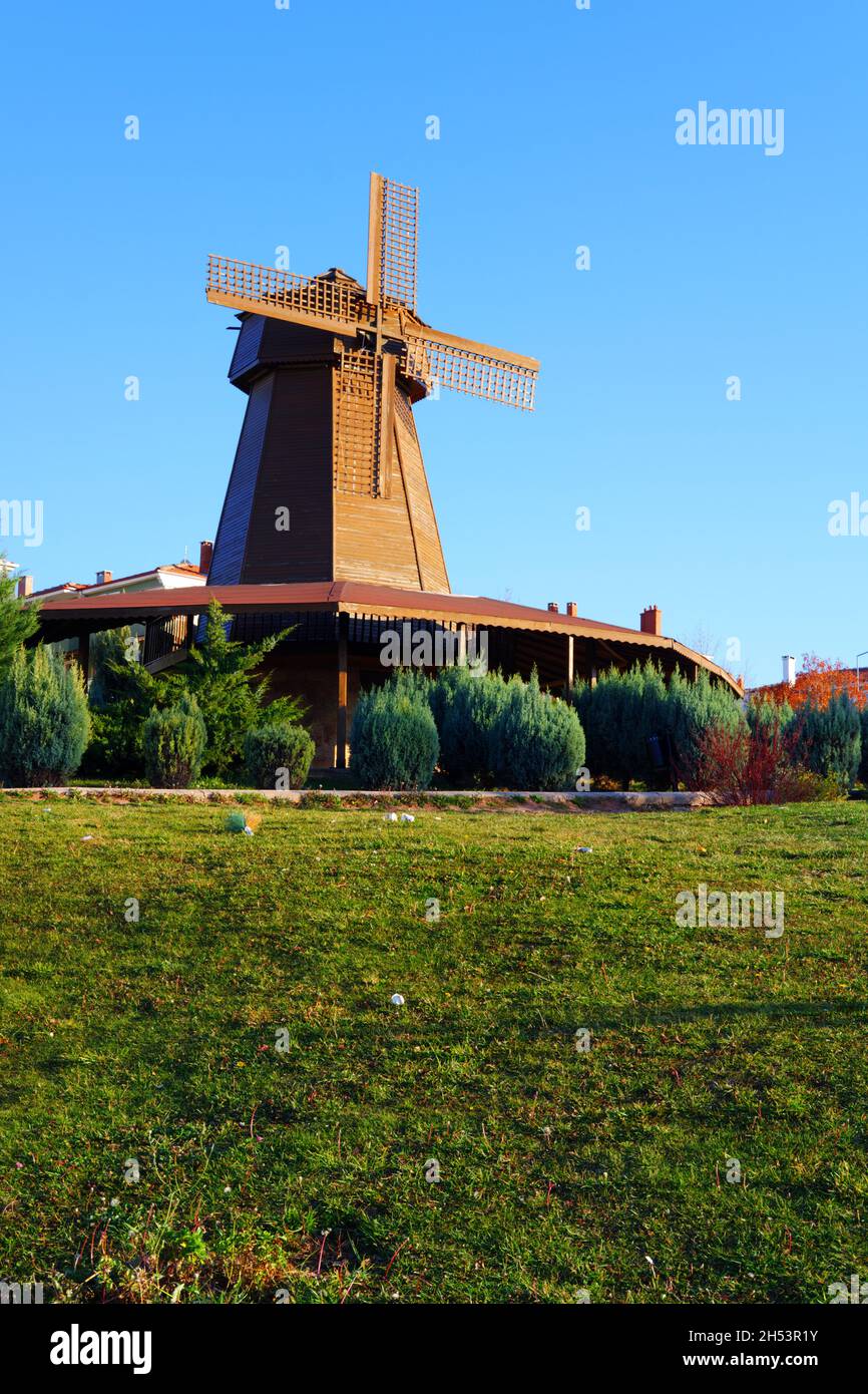 Retro wood windmill tower at a sunny day with clear sky in Eskisehir ...
