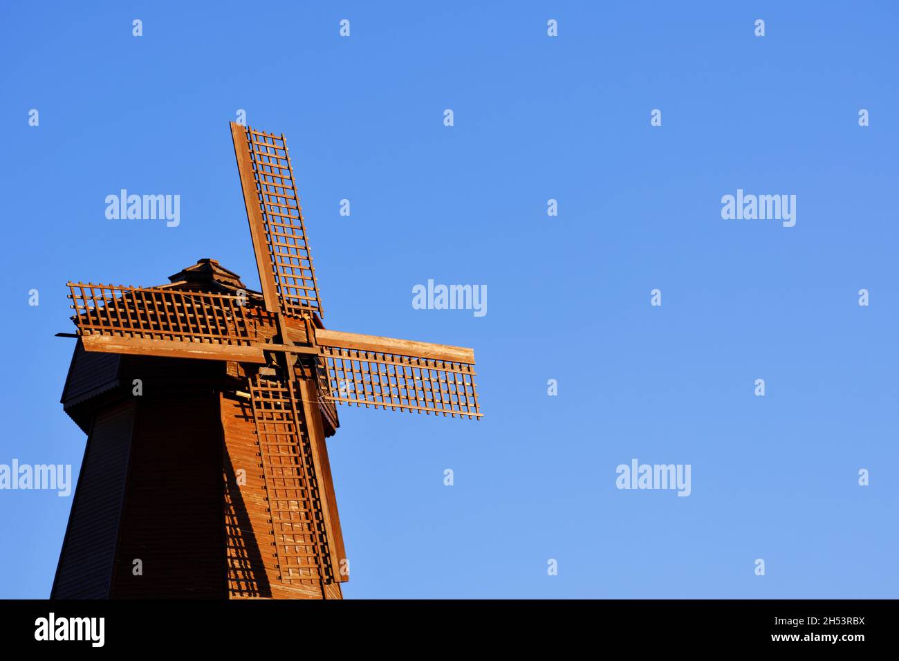Retro wood windmill tower at a sunny day with clear sky Stock Photo - Alamy