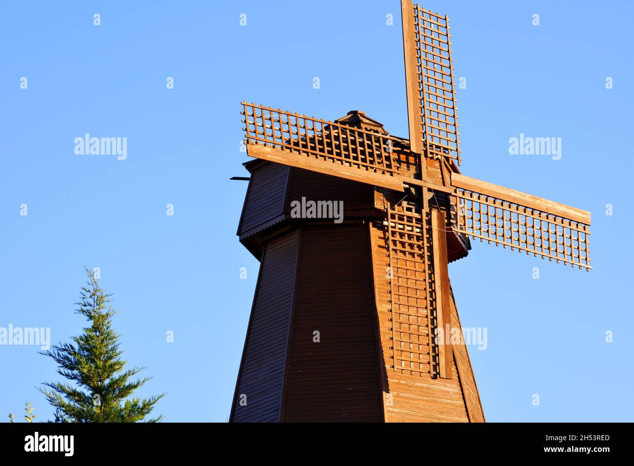Retro wood windmill tower at a sunny day with clear sky Stock Photo - Alamy