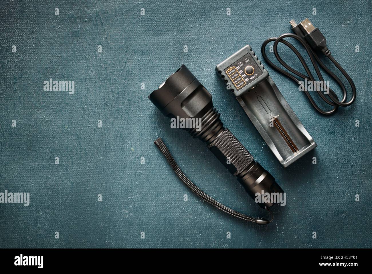 LED pocket torch and battery charger with usb cable, close up Stock ...